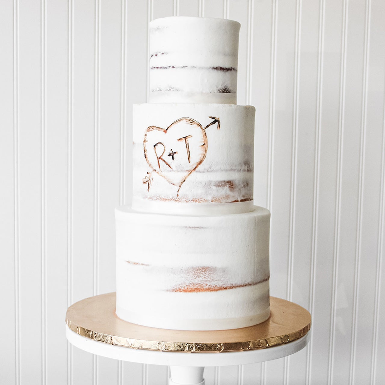 Barely Frosted Carved Monogram Canvas Cake (3-tier) | Frosted Cakery